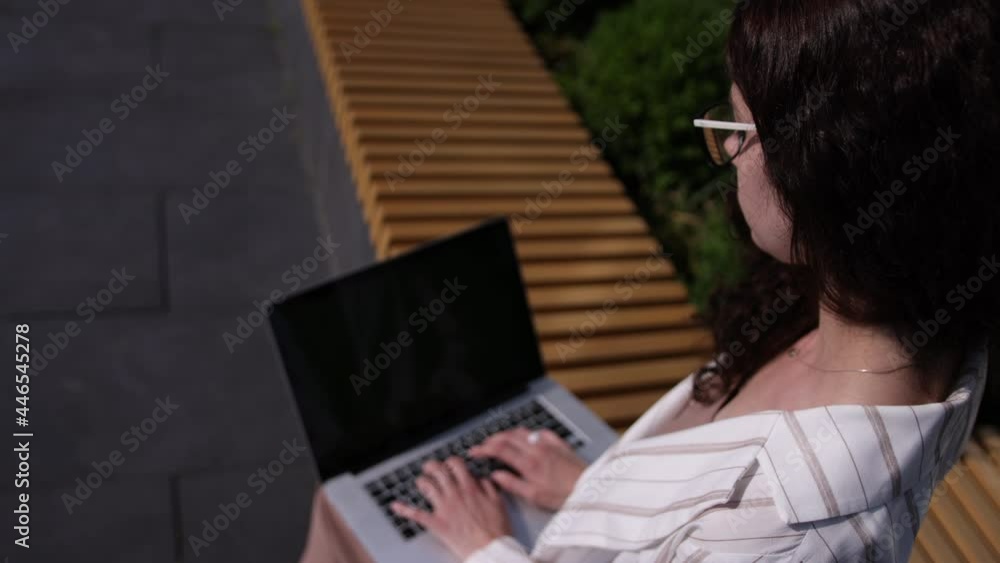 Chroma key green screen. Woman using computer with black screen on the ...