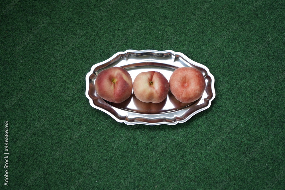 The flat peach (Prunus persica var. platycarpa), also known as the ...