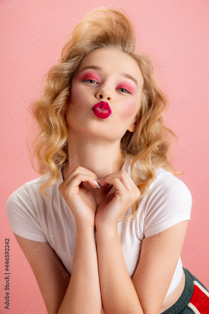 Close-up adorable pretty young girl with bright makeup and hairdo in ...
