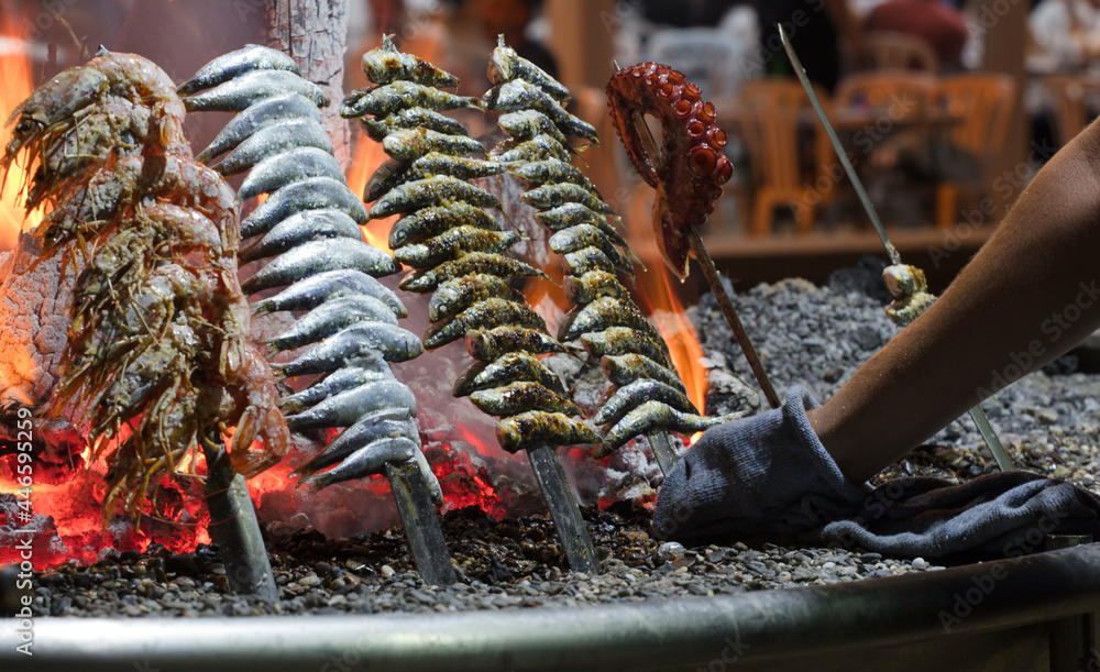 sardines to the fire on the beach Stock Photo | Adobe Stock