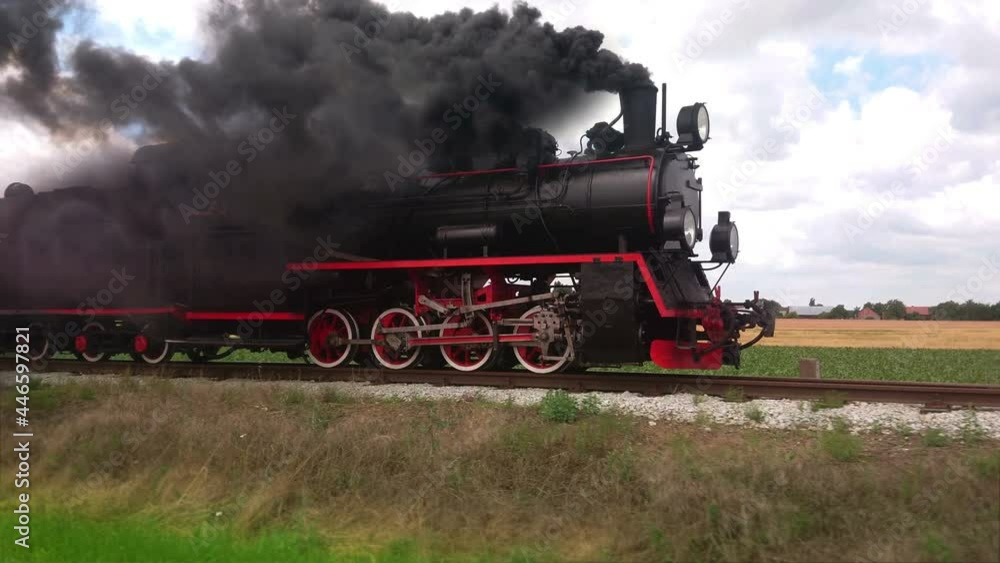 Vintage coal steam locomotive with smoke on trail. Retro transport and ...