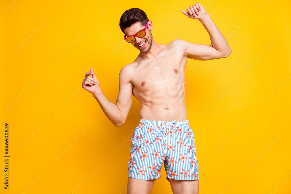 Portrait Of Attractive Shirtless Cheerful Guy Dancing Having Fun
