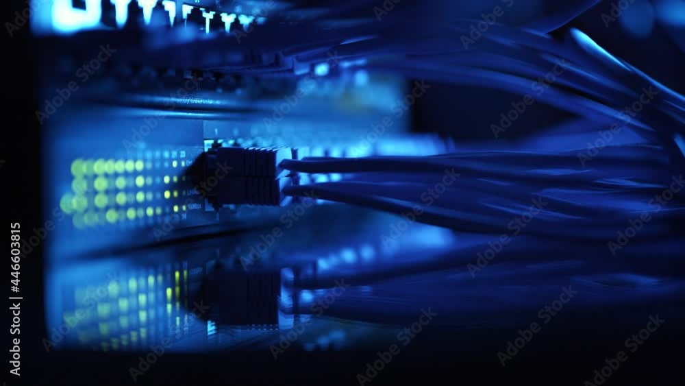 Close up fiber optic in server room. Network cables installed in the ...