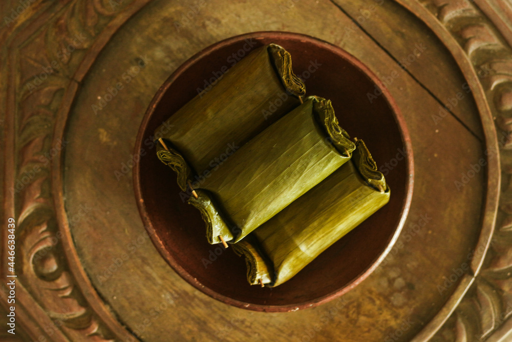 arem-arem is traditional food from java. is rice cake filled with spicy ...