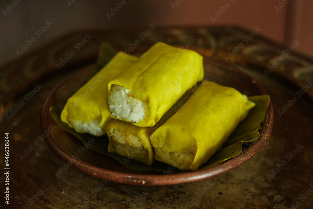 arem-arem is traditional food from java. is rice cake filled with spicy ...