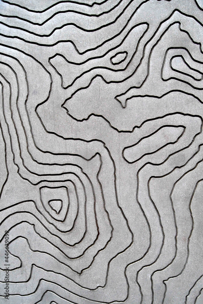 Drilled lines on rock wall provide interest to bare wall and mimic ...