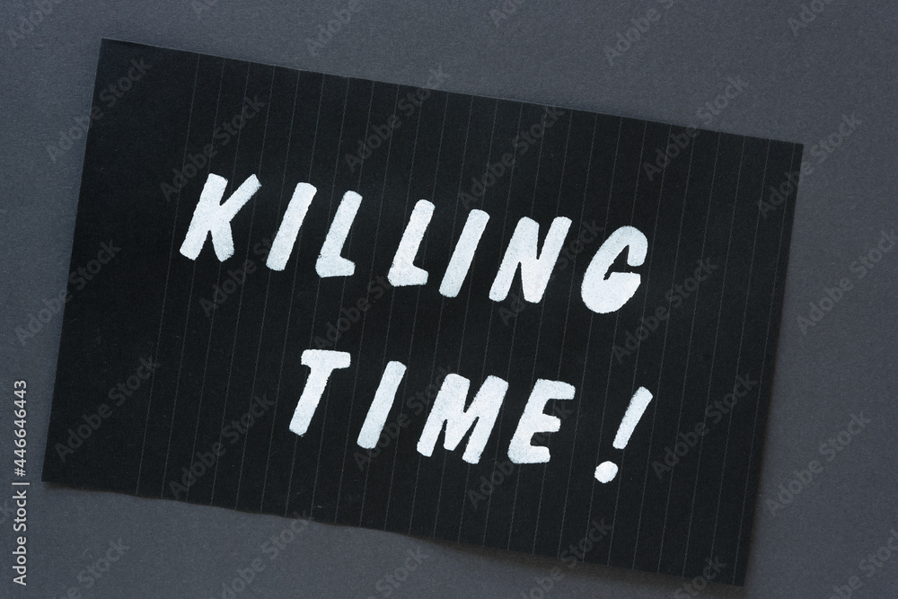 Poster the words "killing time!" in alpha/numeric plastic stencil ...