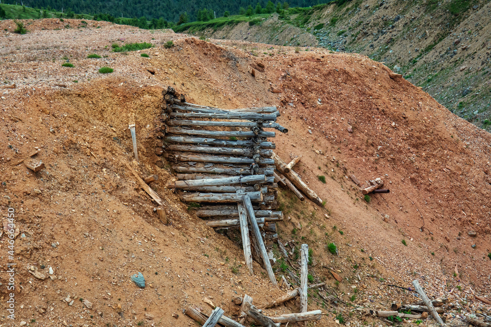 A ruined large log mine high in the mountains. Extraction of minerals ...