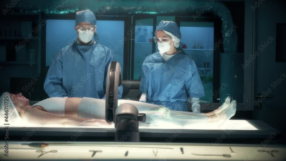 Team of surgeons perform a delicate operation using modern medical full ...