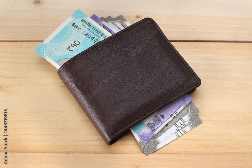 Indian currency notes with a wallet. Stock Photo | Adobe Stock