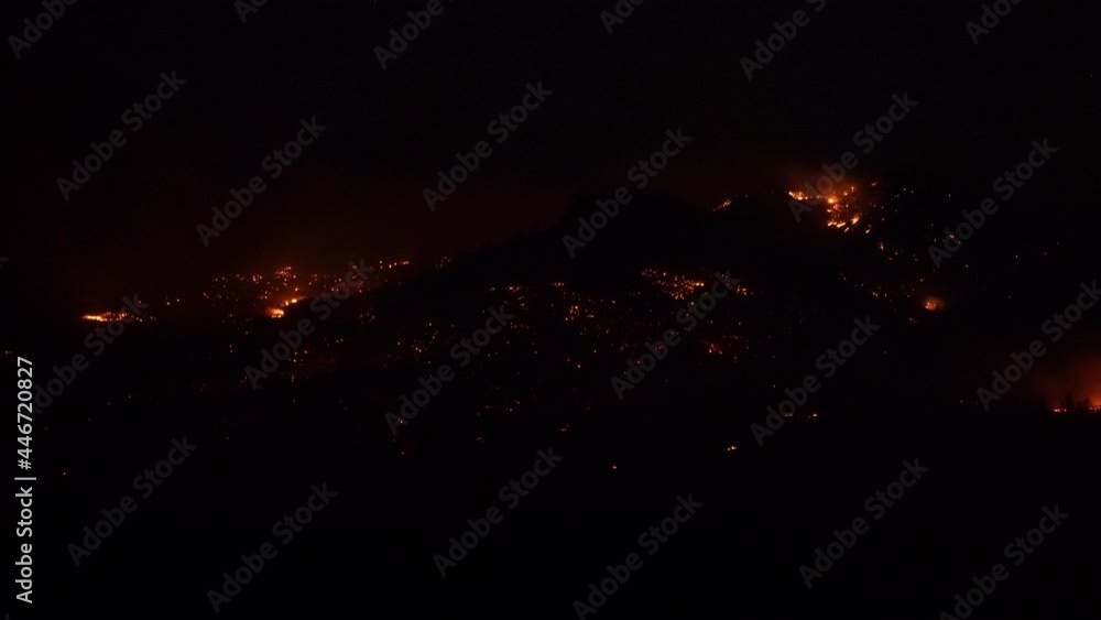 Wildfire aftermath - forest fires left glowing red piles of ash in the ...