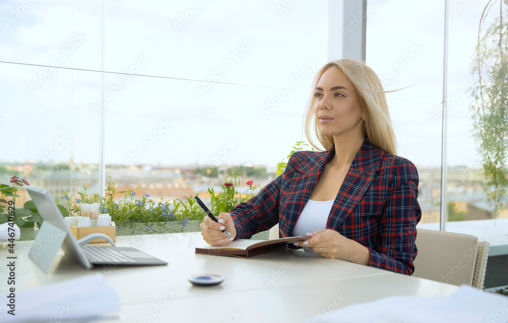 girl, business woman working at a laptop in a panoramic restaurant, on ...
