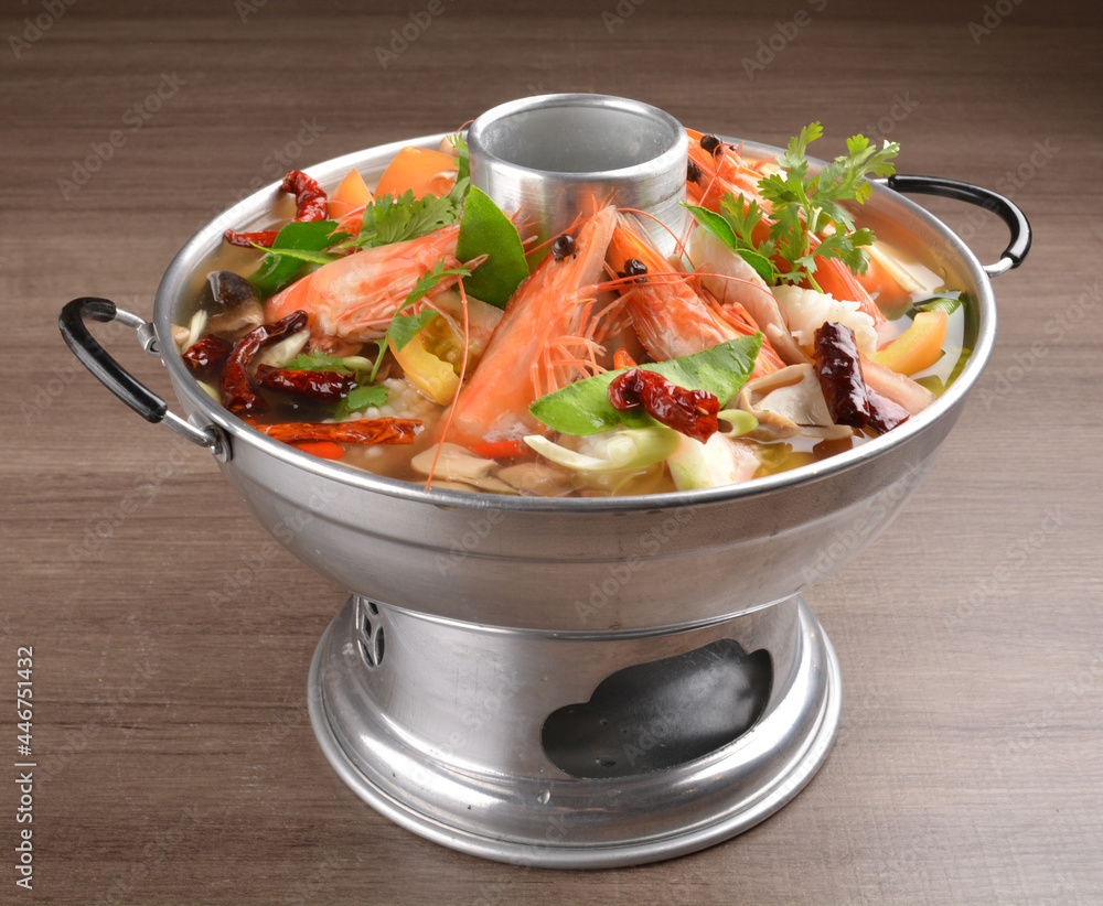 thai clear tom yum spicy chilli hot soup with seafood, meat and ...