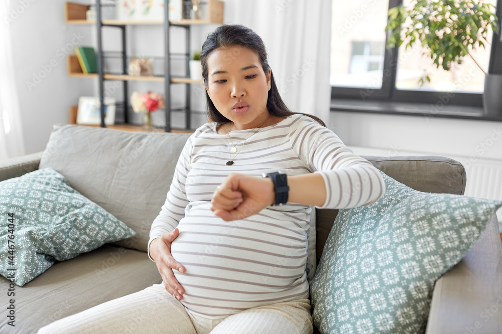 pregnancy, rest, people and expectation concept - pregnant asian woman ...