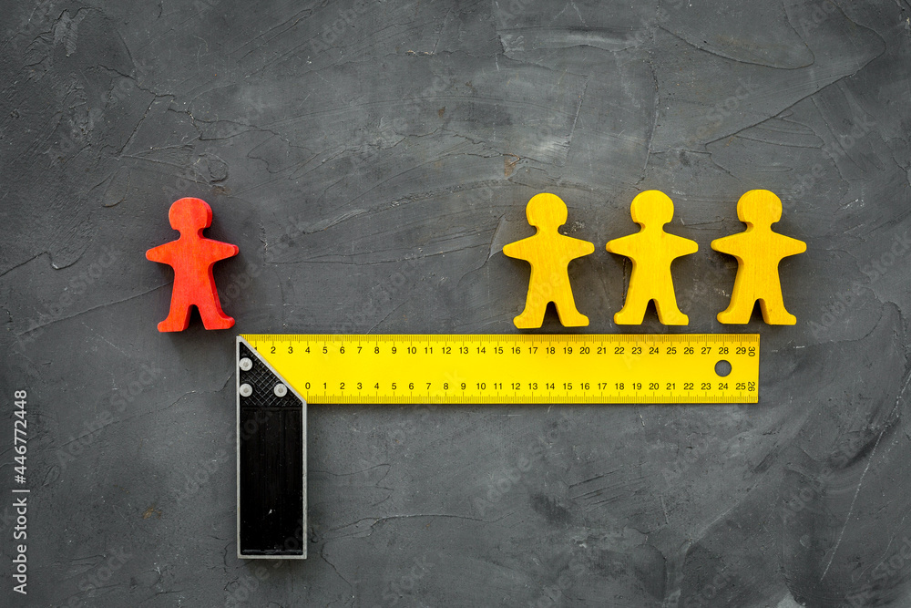 Keep social distance concept with two man figures and metal ruler Stock ...