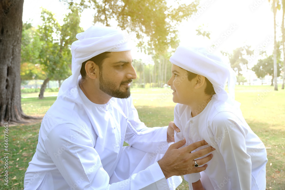 Foto de Arab father and son together as part cultural traditional ...