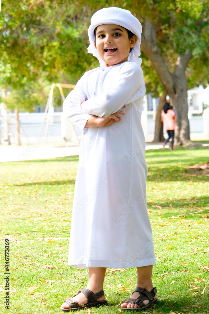 Portrait of Young Arab boy wearing kandoora for kids playing outside ...