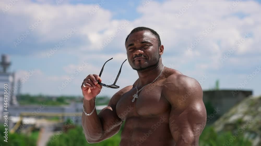 Waist up portrait view of the strong stylish man wearing glasses while ...