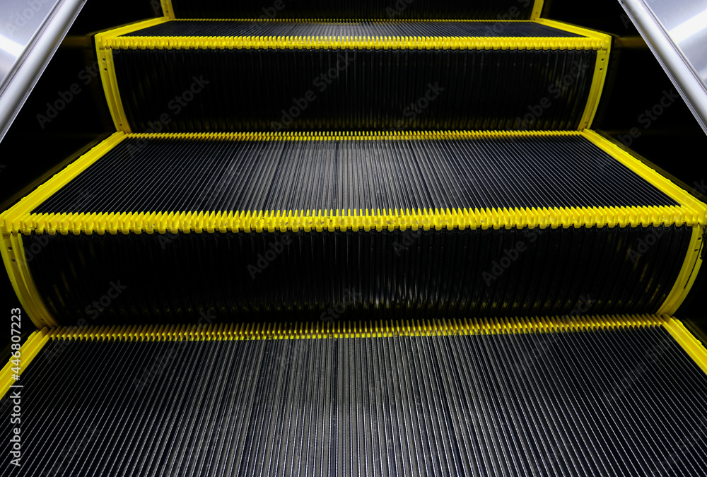Escalator in shopping Mall in Japan, electric moving up staircase.Close ...