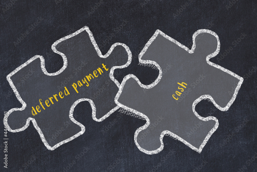 Chalk drawing of two puzzles with words deferred payment and cash Stock ...