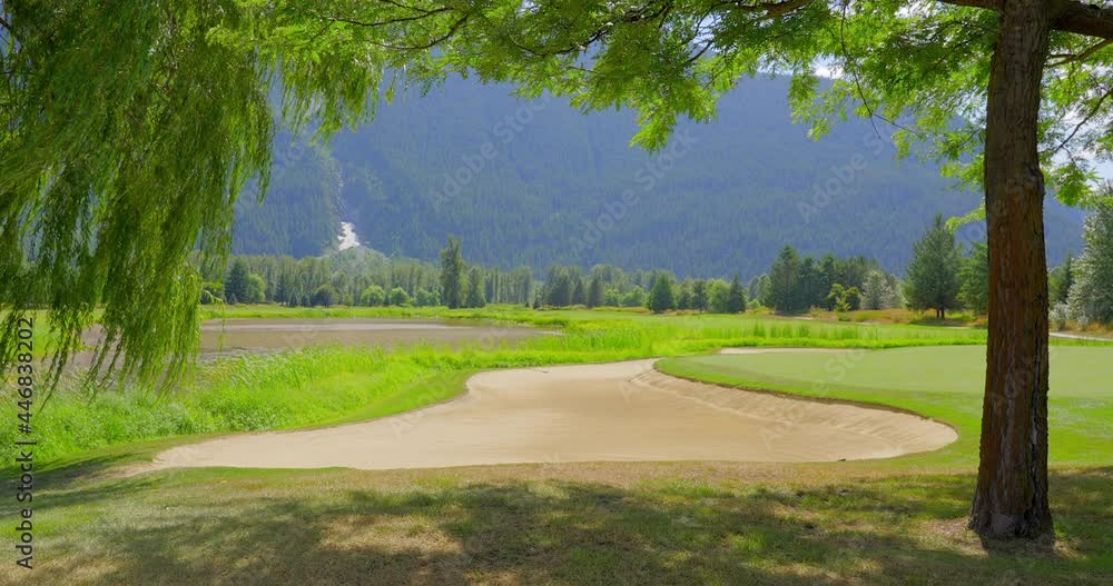 Establishing shot of golf course with gorgeous green and fantastic ...