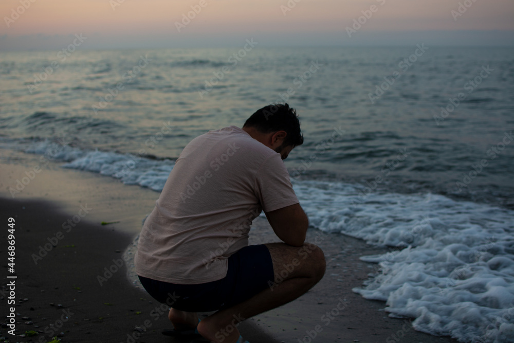 sad man by the sea. Stock Photo | Adobe Stock
