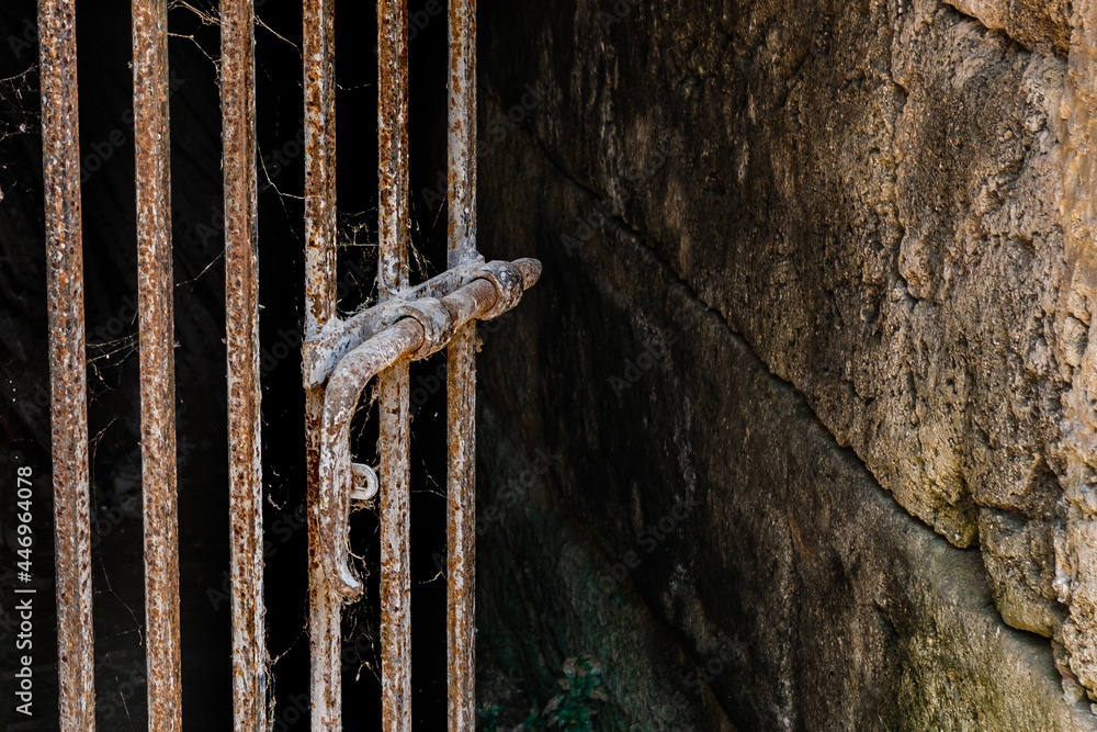 Old metal open door in stone brick wall, rusty lock Stock Photo | Adobe ...
