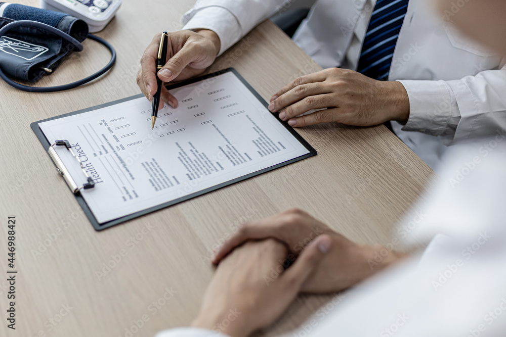 The doctor is explaining the details of the patient's physical ...