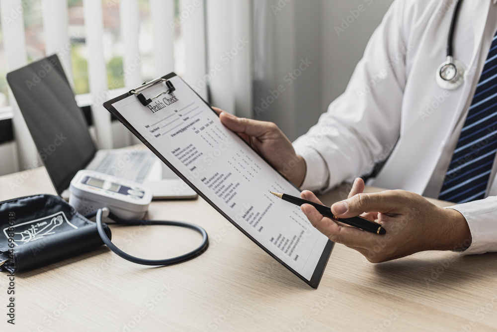 The doctor is explaining the details of the patient's physical ...