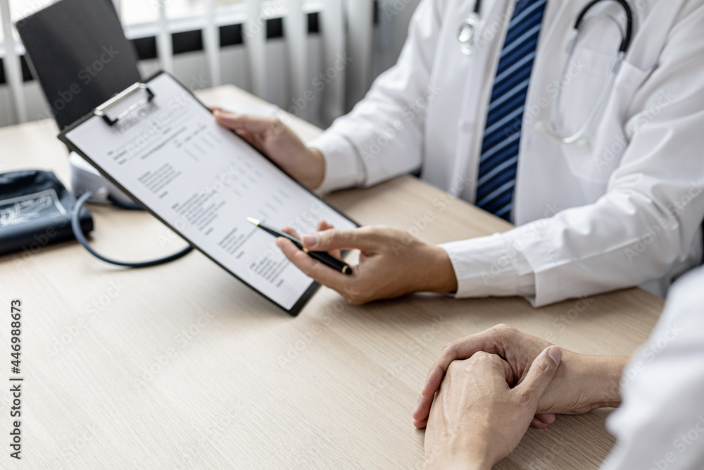 The doctor is explaining the details of the patient's physical ...