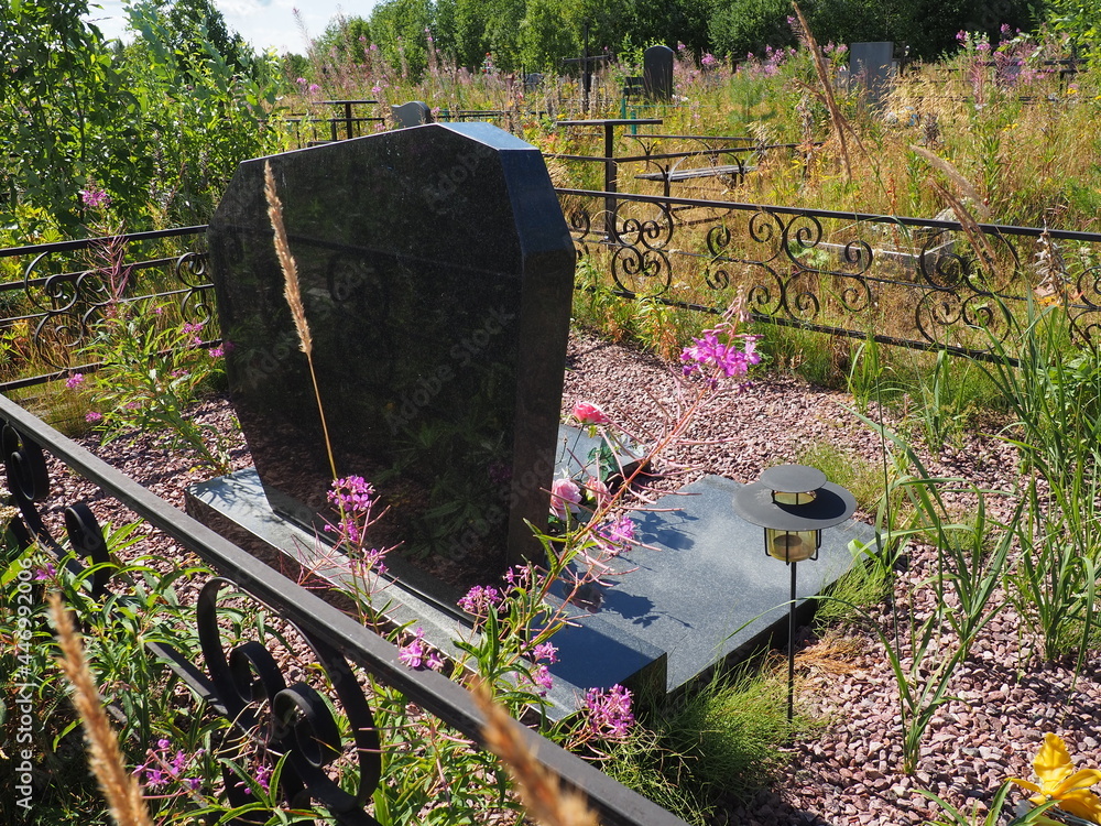 Cemetery with stone monuments. Old abandoned cemetery in the afternoon ...