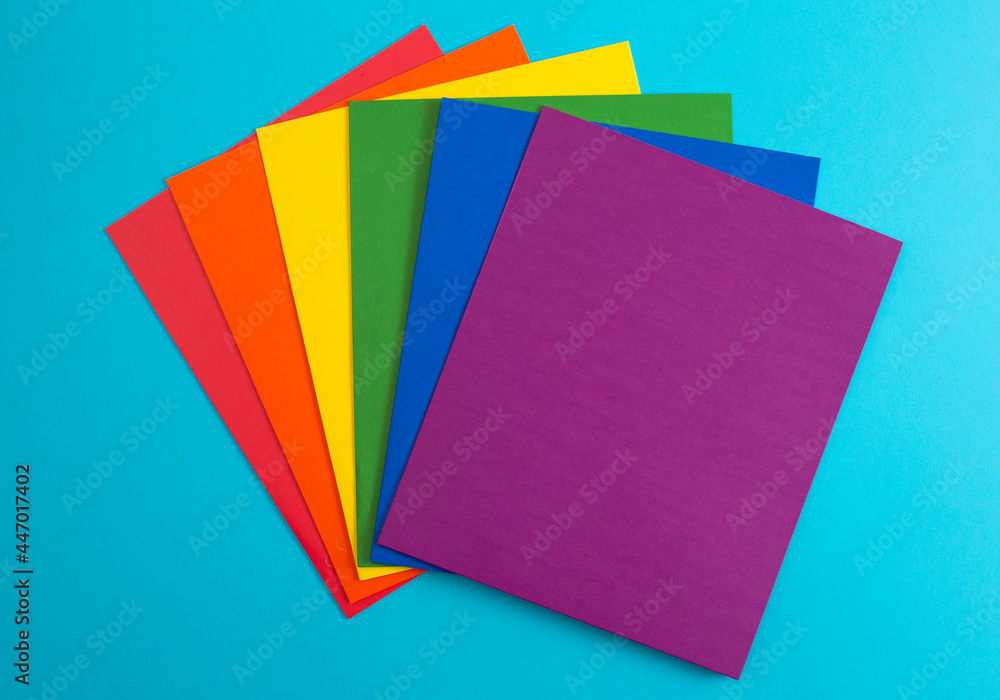 Rainbow Folders of School or Office Supplies on a Blue Background Stock ...