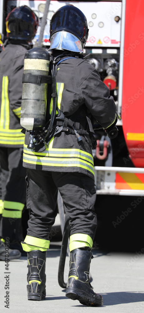 firefighter with oxygen cylinder of self-contained breathing apparatus ...