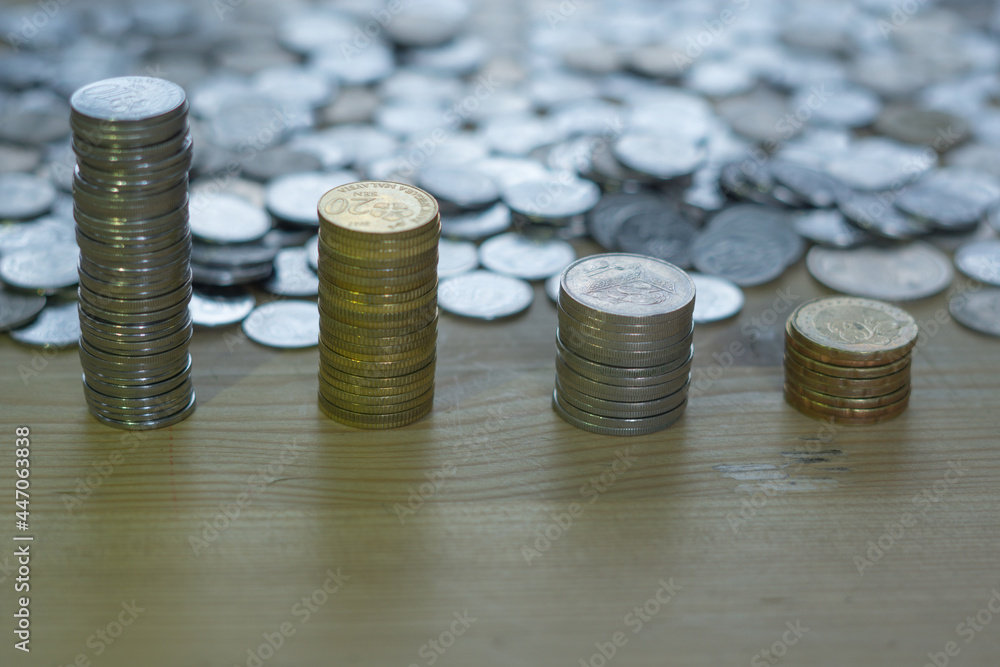 Malaysia ringgit coin stack growing, symbolling the money saving ...