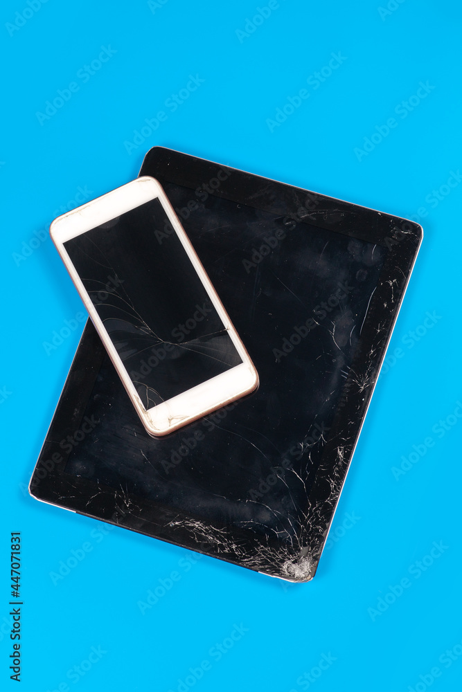 Tablet laptop and mobile phone with broken and dirty screen glass ...