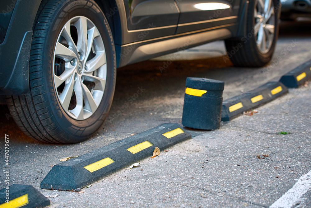 Minsk, Belarus. Jul 2021. Rubber barrier for cars . Rubber wheel stops ...
