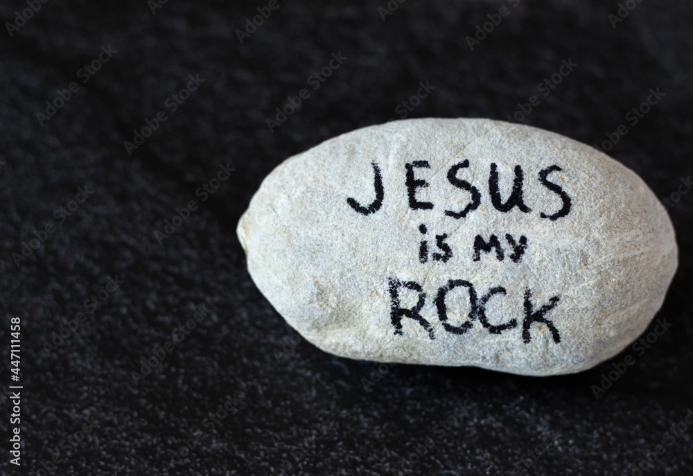 Jesus is my Rock and Salvation. Solid rock with a handwritten message. Christ is firm foundation ...