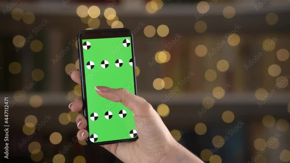 Closeup view of smartphone with tracking points in woman hands on the ...