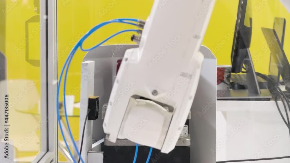 Commercial production concept, robotic automated equipment in action ...