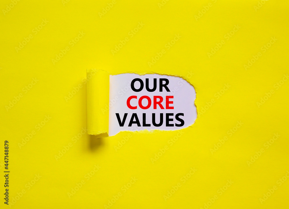 Our core values symbol. Words 'Our core values' appearing behind torn ...