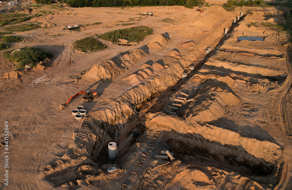 Laying of underground storm sewer pipes and sewerage well. Construction ...