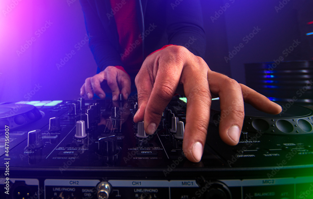 Dj hands on the turntable. Stock Photo | Adobe Stock