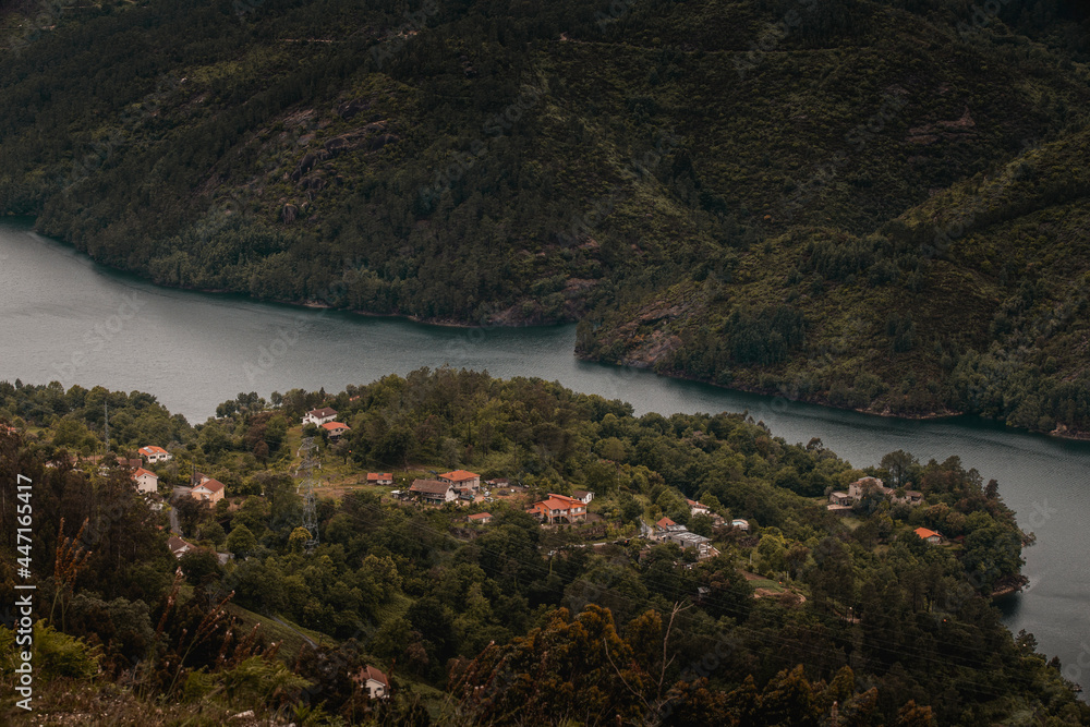 Mountain landscape with river passing through a valley, Vieira do Minho ...