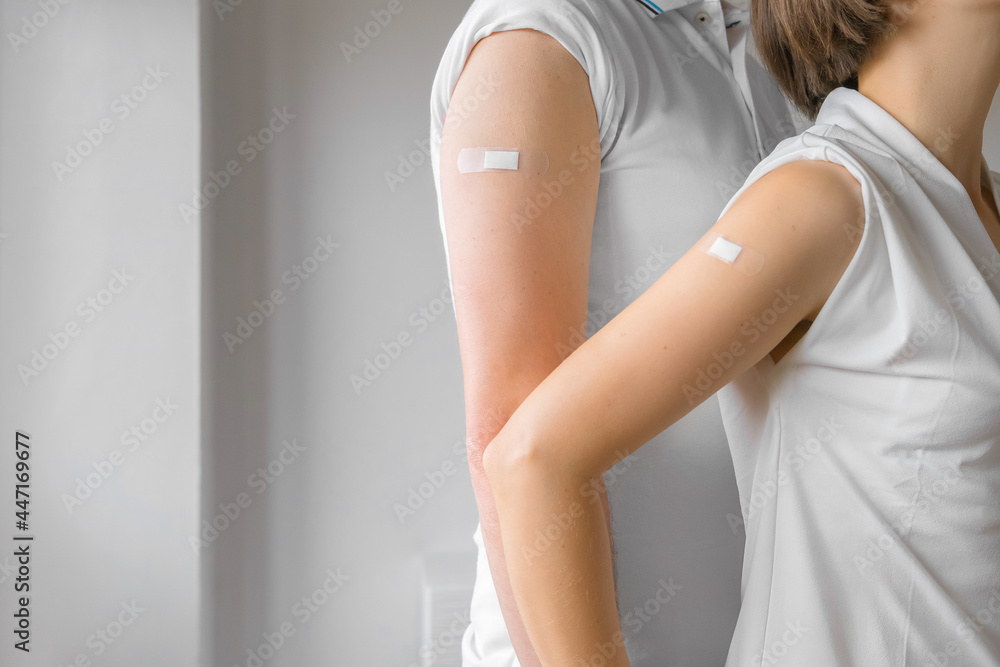 Unrecognized Vaccinated Woman and Man Showing Arm With Medical Patch ...