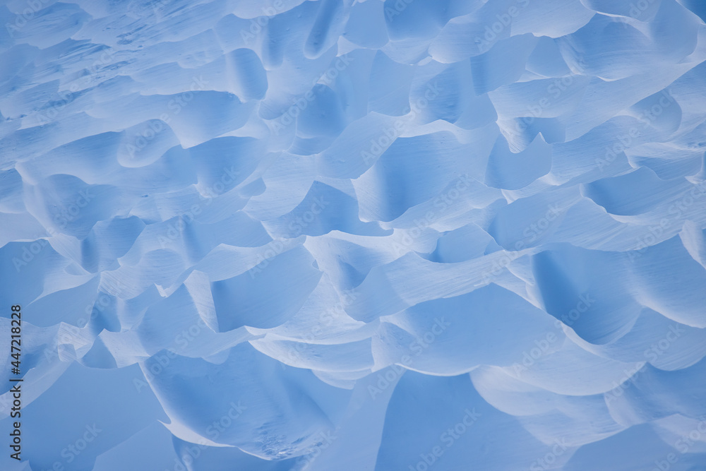 Snow texture. Wind sculpted patterns on snow surface. Wind in the ...
