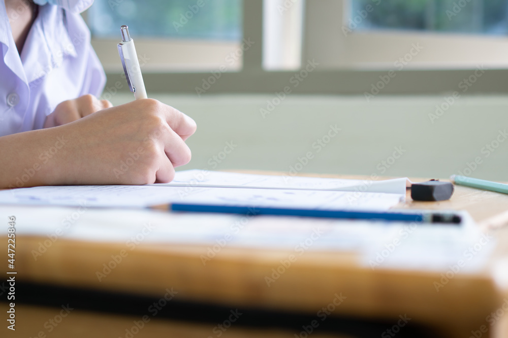 Foto de Girl Student in exam test school, Side View of high school or ...