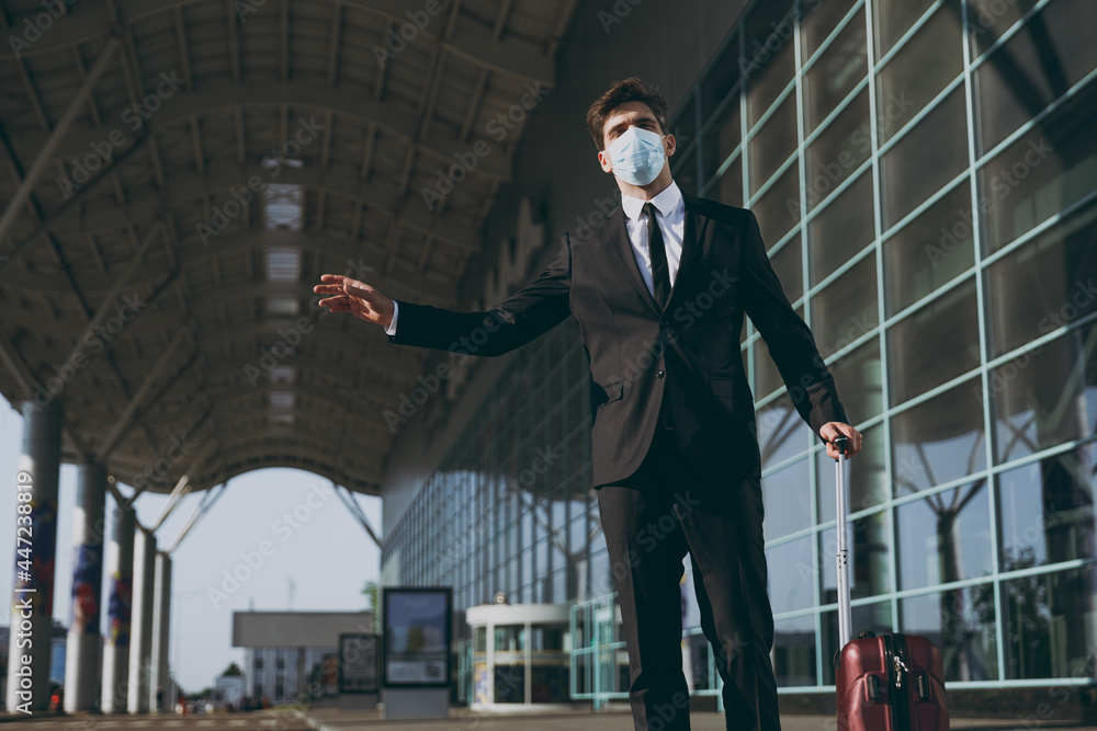 Bottom view young traveler businessman man in black suit sterile facial ...