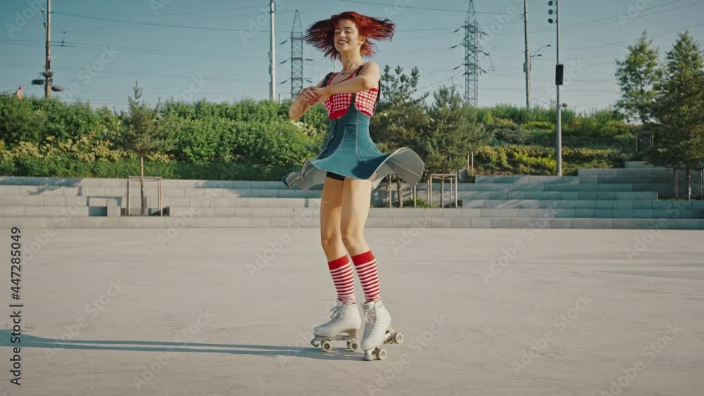Young beautiful lady in classic roller skates figure rollerblading ...