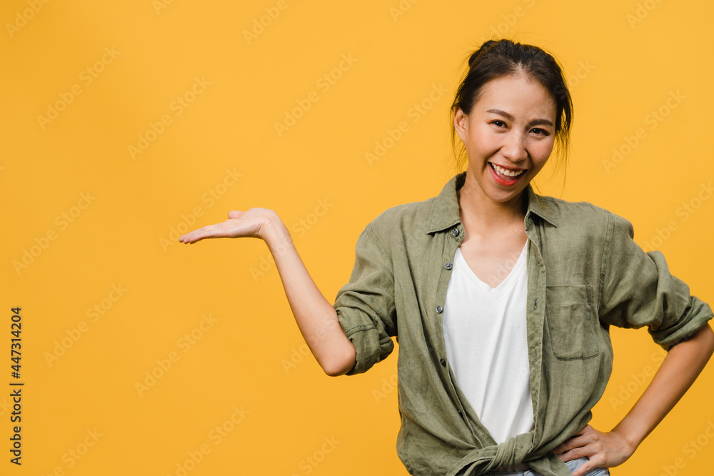 Portrait of young Asian lady smiling with cheerful expression, shows ...