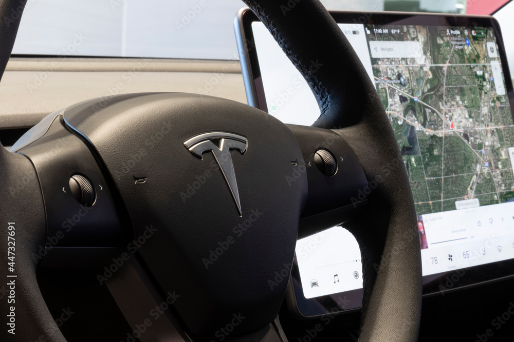 Tesla electric vehicles electrified interior. Tesla products include ...